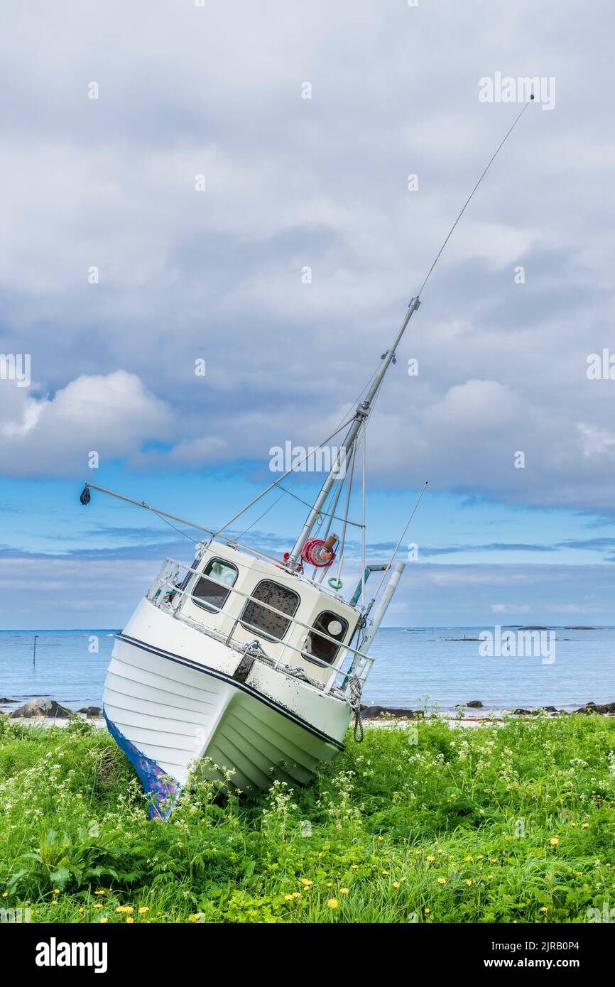 Norway, Nordland, Fishing boat lying on coast of Andoya island with ...