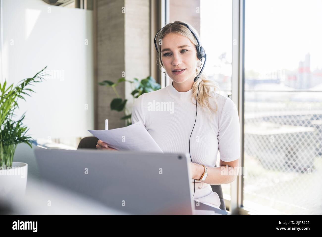 Customer service representative with document working in office Stock ...