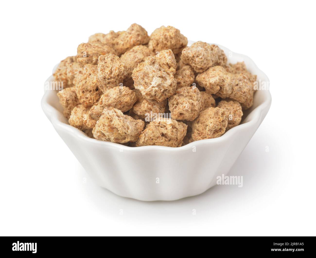 Bowl of textured soy protein chunks isolated on white Stock Photo - Alamy