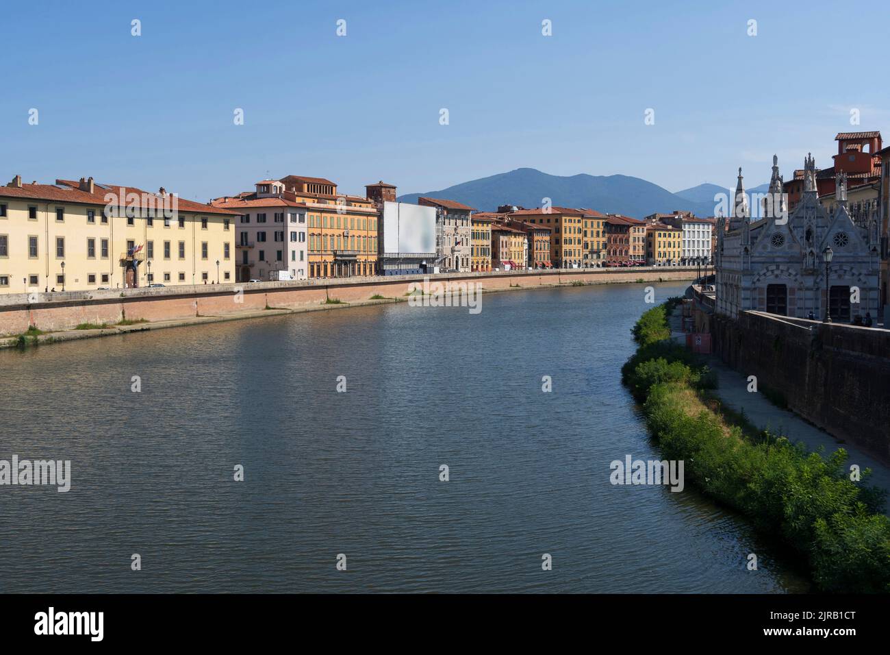 Italy, Tuscany, Pisa, Arno river canal with residential buildings and ...