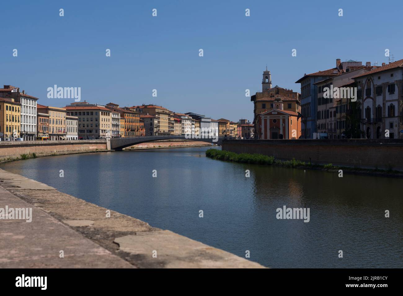 Italy, Tuscany, Pisa, Arno river canal with residential buildings and ...