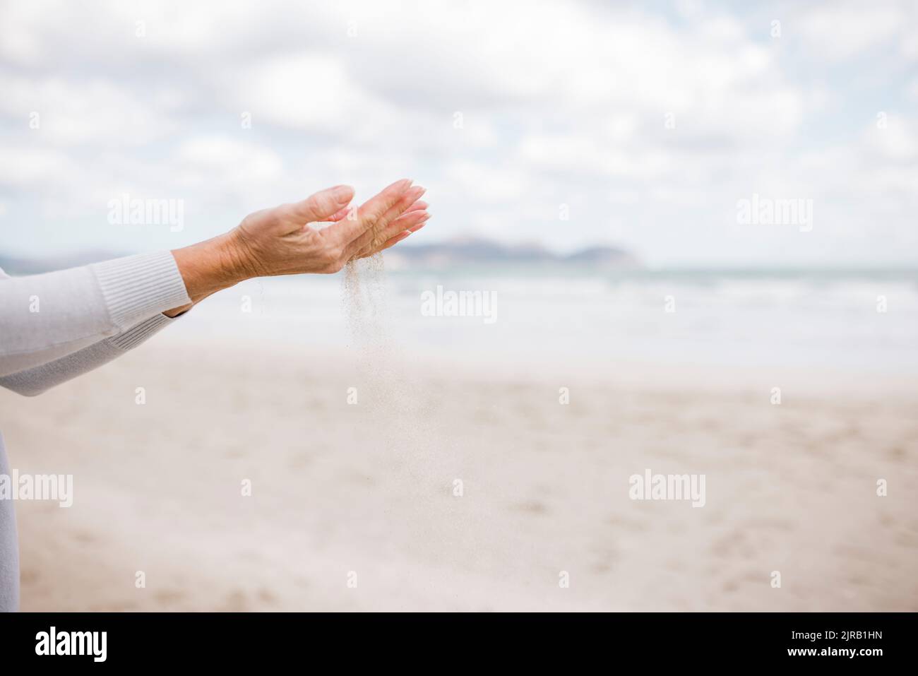Sand falling from woman hands hi-res stock photography and images - Alamy
