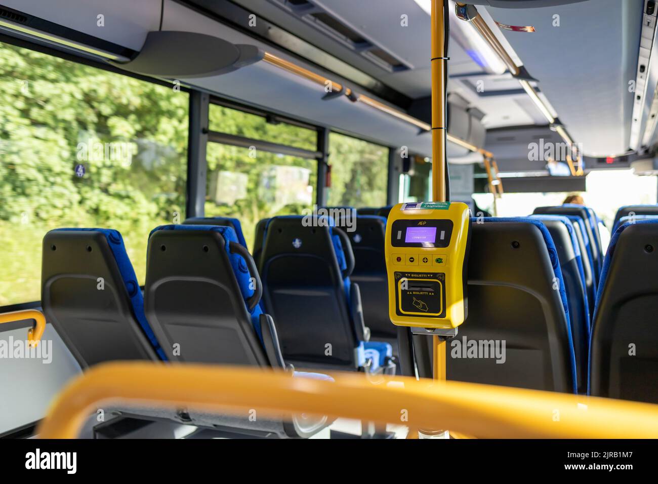 The seats and modern touch payment terminal in a local bus Stock Photo ...