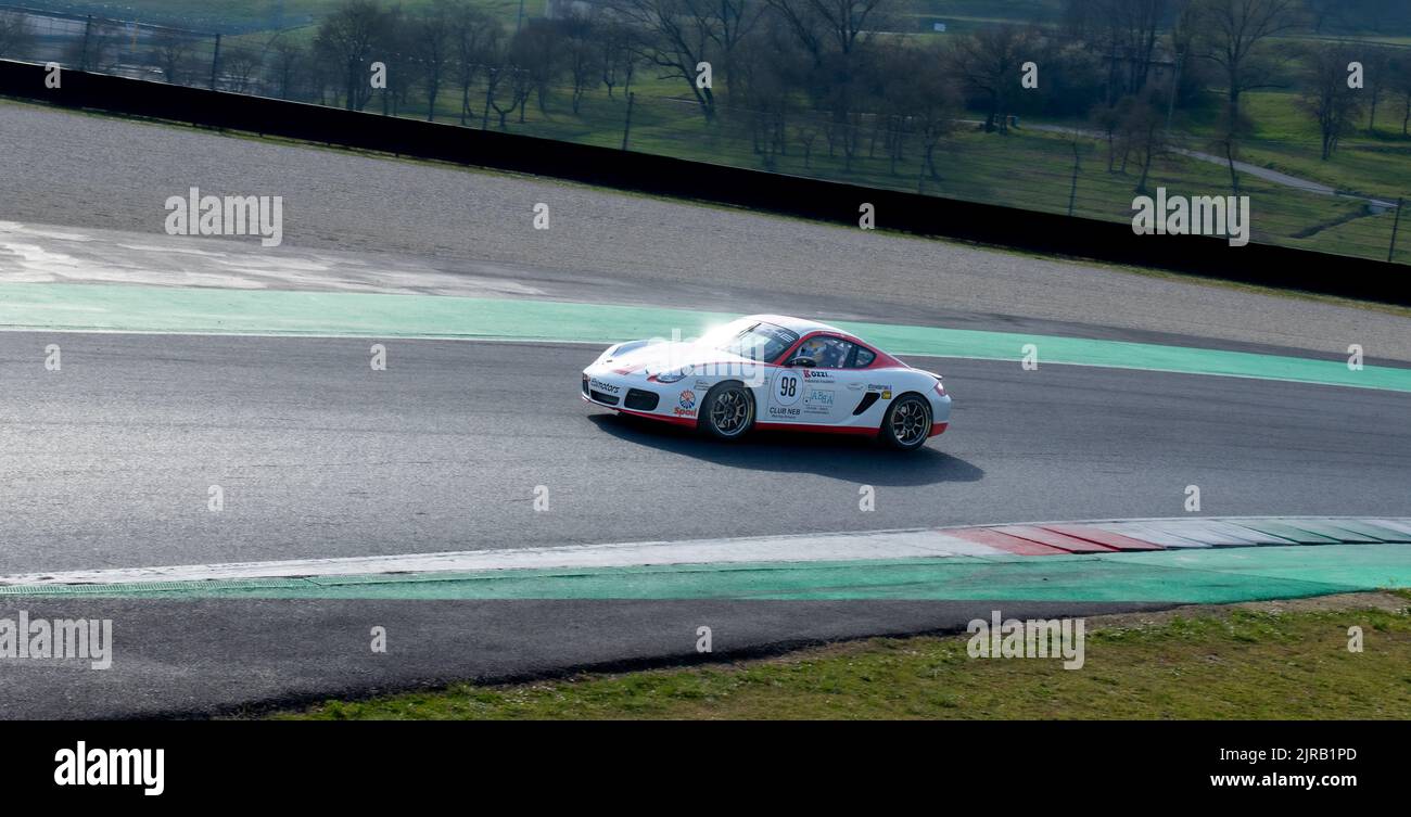 Porsche 911 racing car action on racetrack. Mugello, Italy, march 25 ...