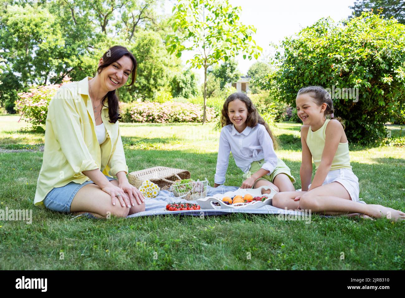 Happy daughters having picnic hi-res stock photography and images - Alamy