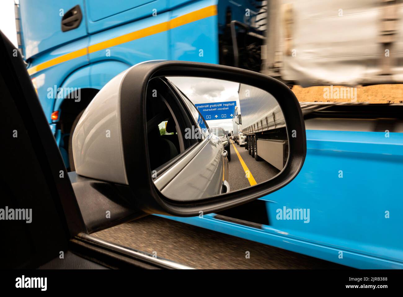 Traffic jam reflecting in side-view mirror Stock Photo - Alamy