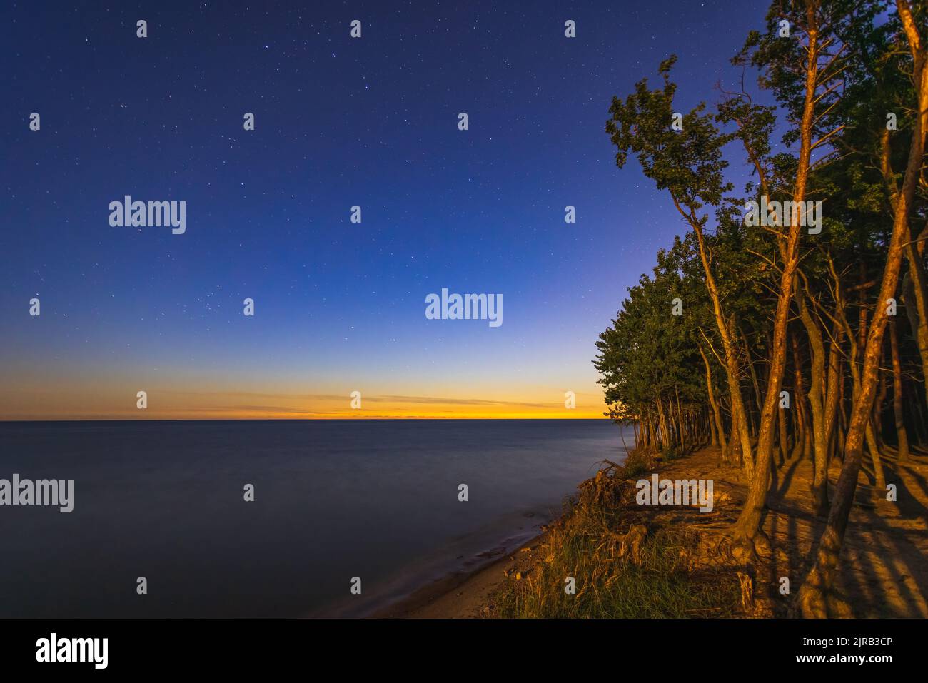 Dutch man cap landscape at night in Lithuania. Beautiful seaside ...