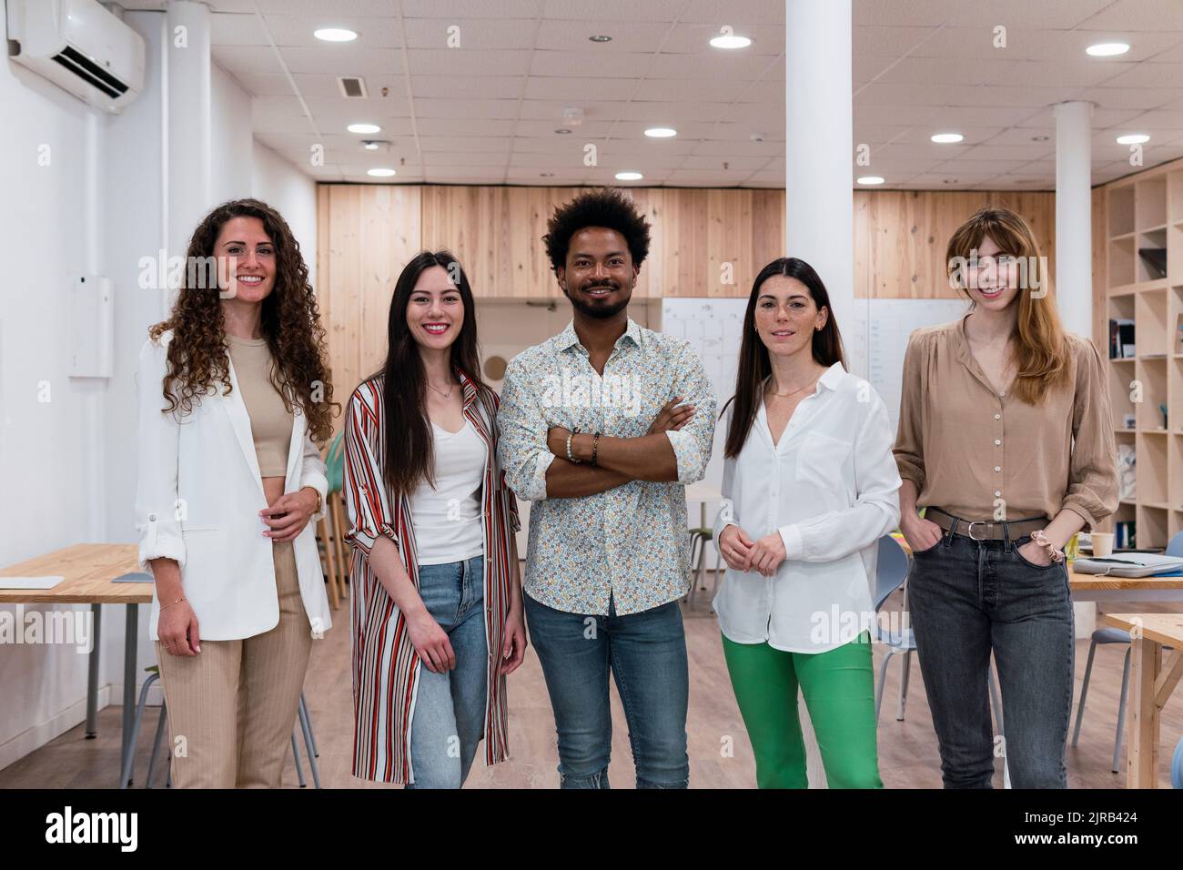 Portrait of confident business team in office Stock Photo - Alamy