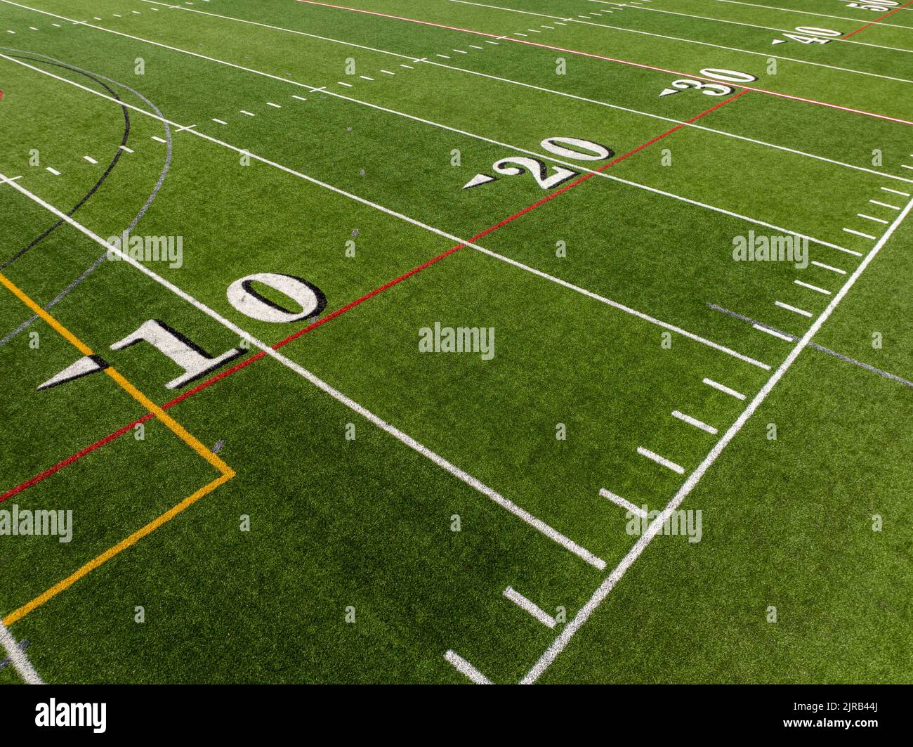 Synthetic turf slanted football 0 yard line in white with black number ...