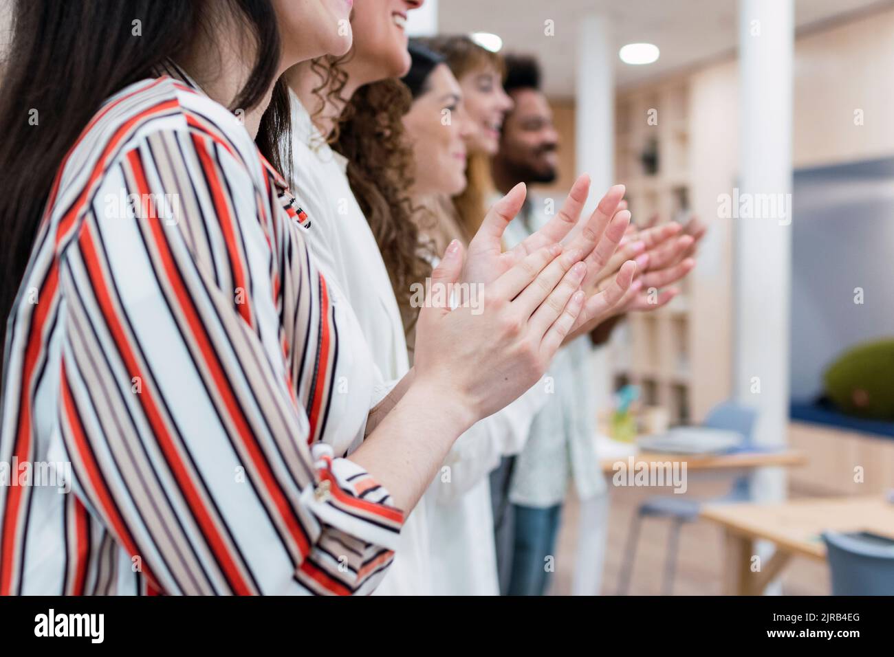 Business team clapping hands after a presentation in office Stock Photo ...