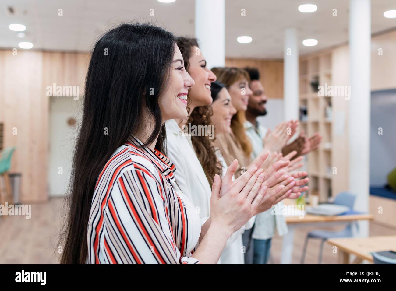 Business team clapping hands after a presentation in office Stock Photo ...