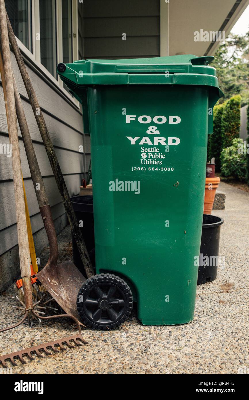 A vertical shot of plastic trash can outdoors Stock Photo - Alamy