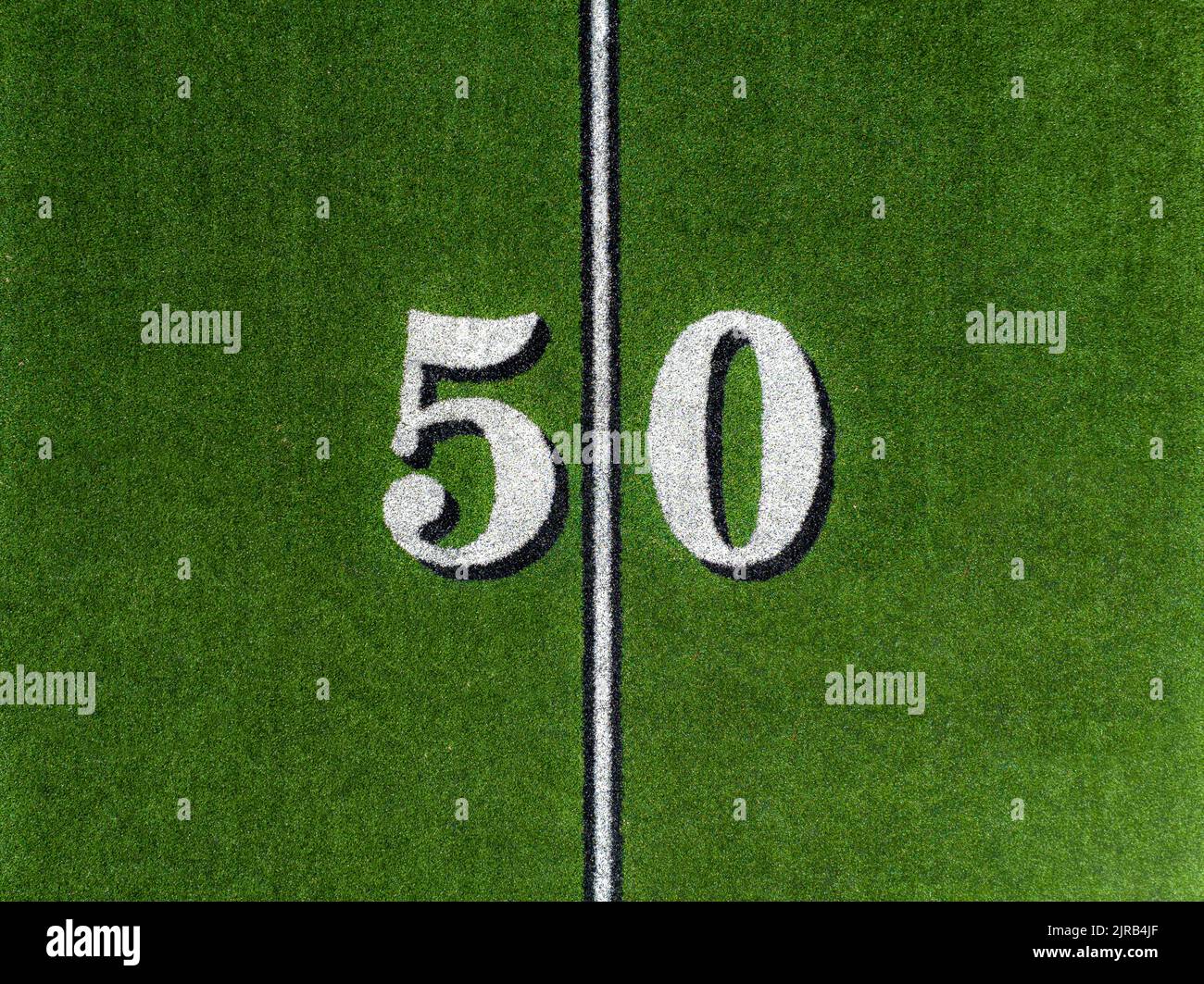 Synthetic turf slanted football 50 yard line in white with black number ...