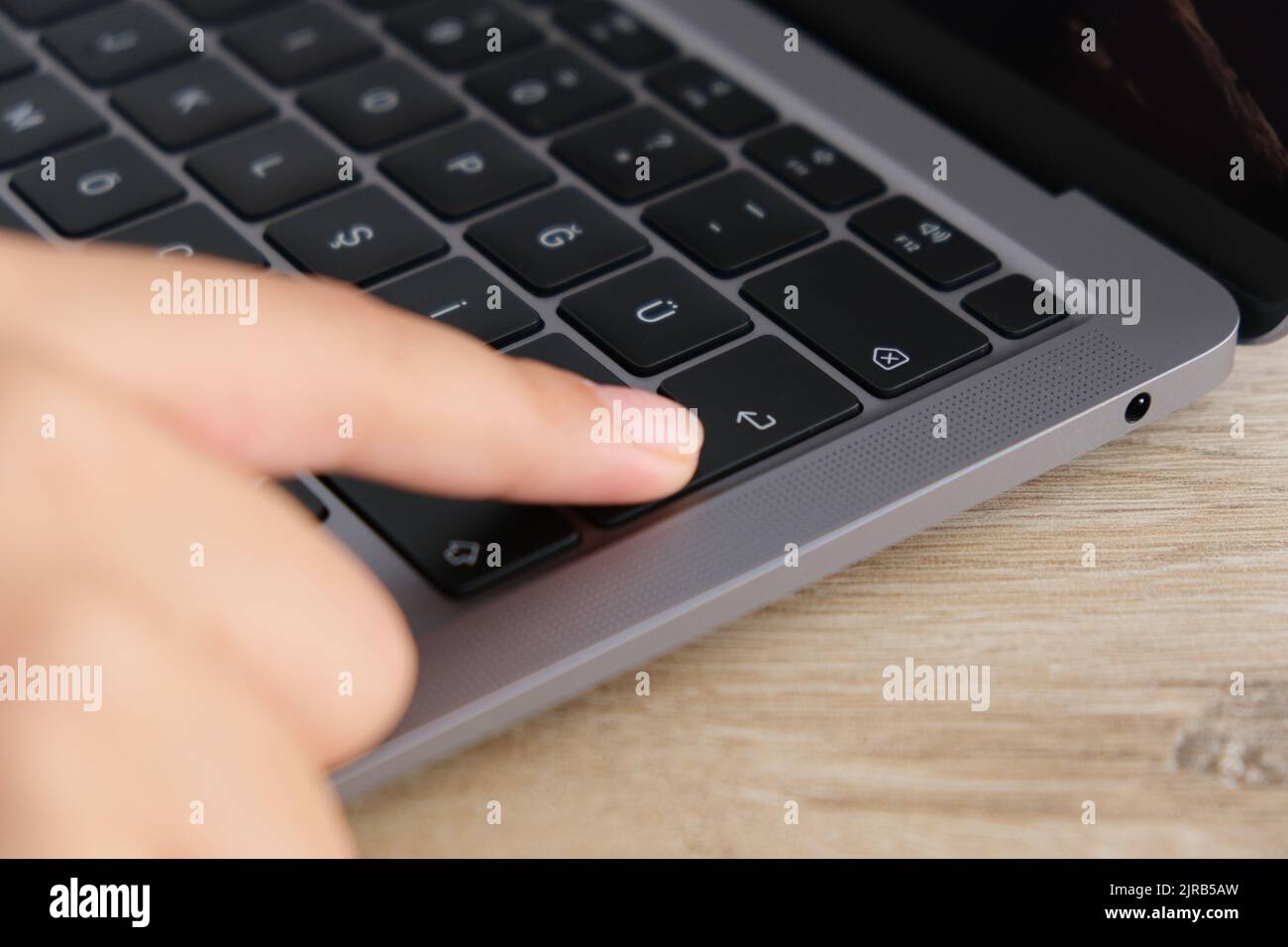 Enter button, woman finger pressing enter button Stock Photo - Alamy