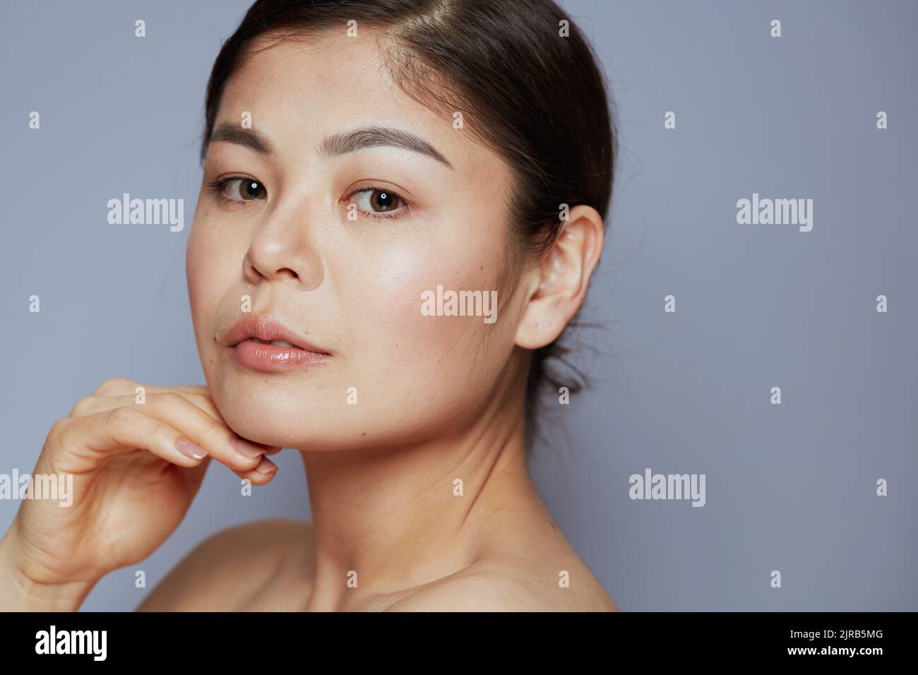 modern asian female on blue background Stock Photo - Alamy