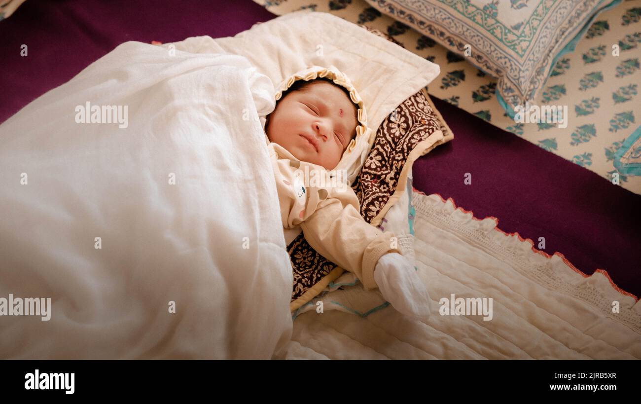 A newborn indian baby lying on the back Stock Photo - Alamy
