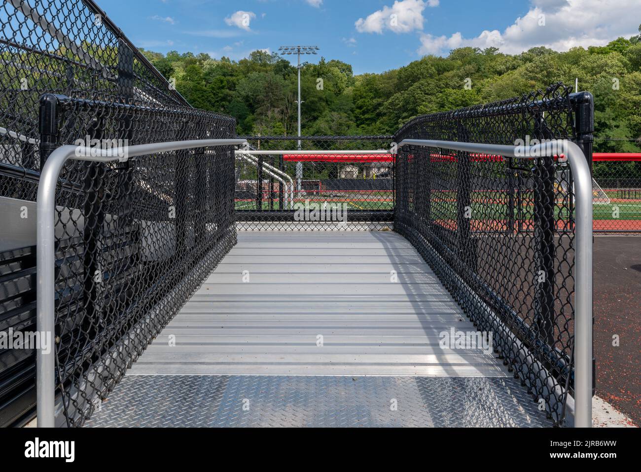 Accessible wheelchair ramp with railings and slip resistant surface at ...