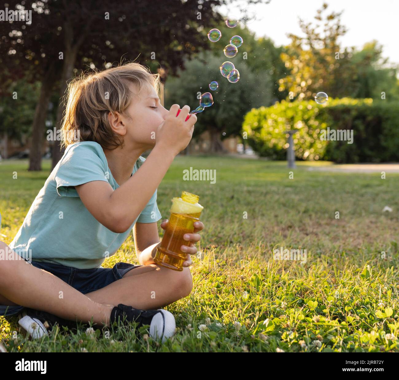 Sitting blowing hi-res stock photography and images - Alamy