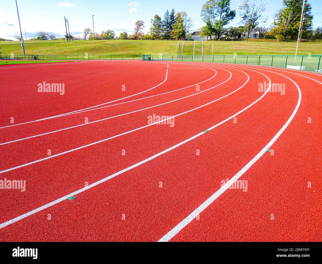 Running track slot drain along radius, adjacent to steeplechase Stock ...