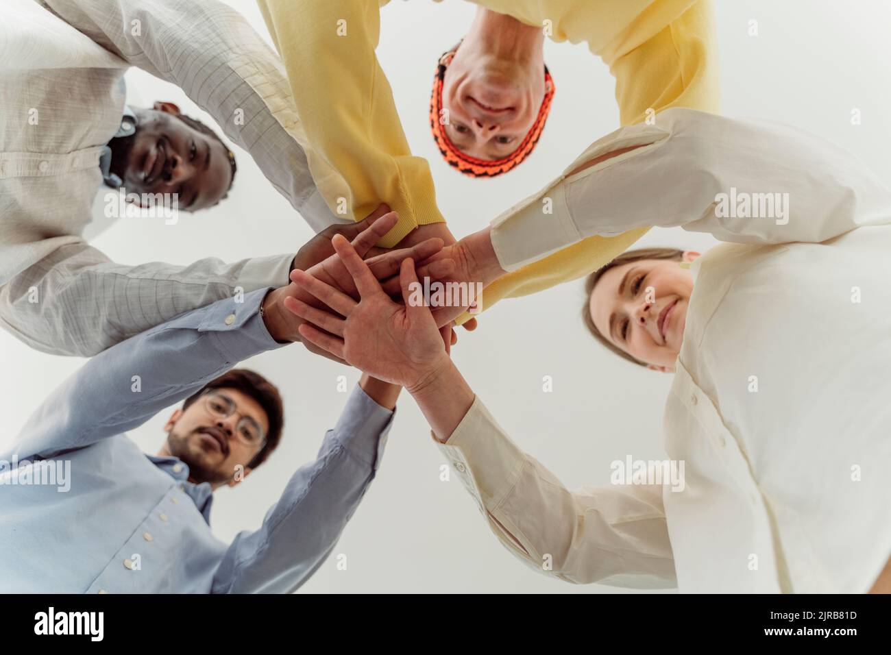 Smiling colleagues having team building training Stock Photo - Alamy