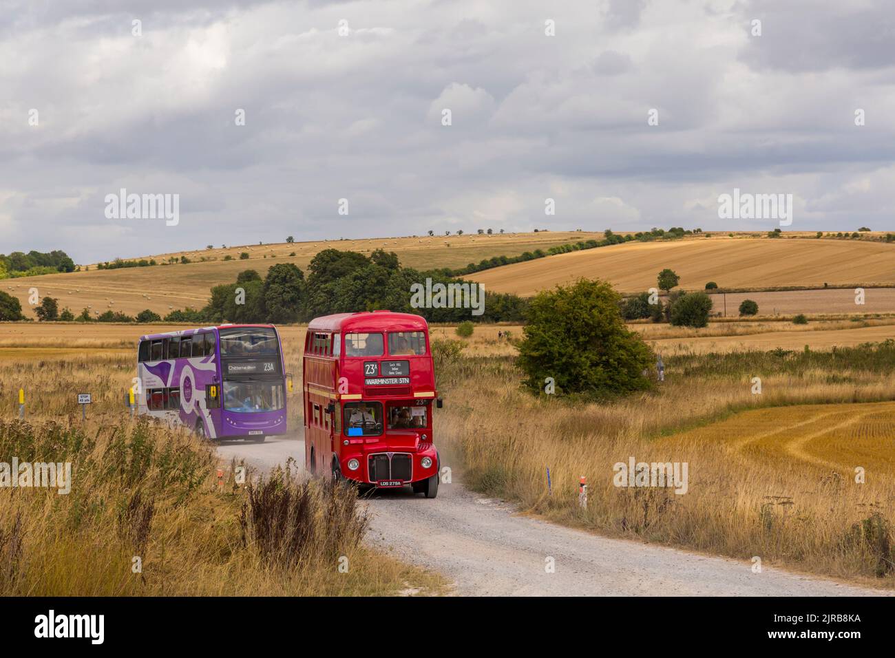 Red double decker bus and purple bus on Open Day, Imberbus event at ...