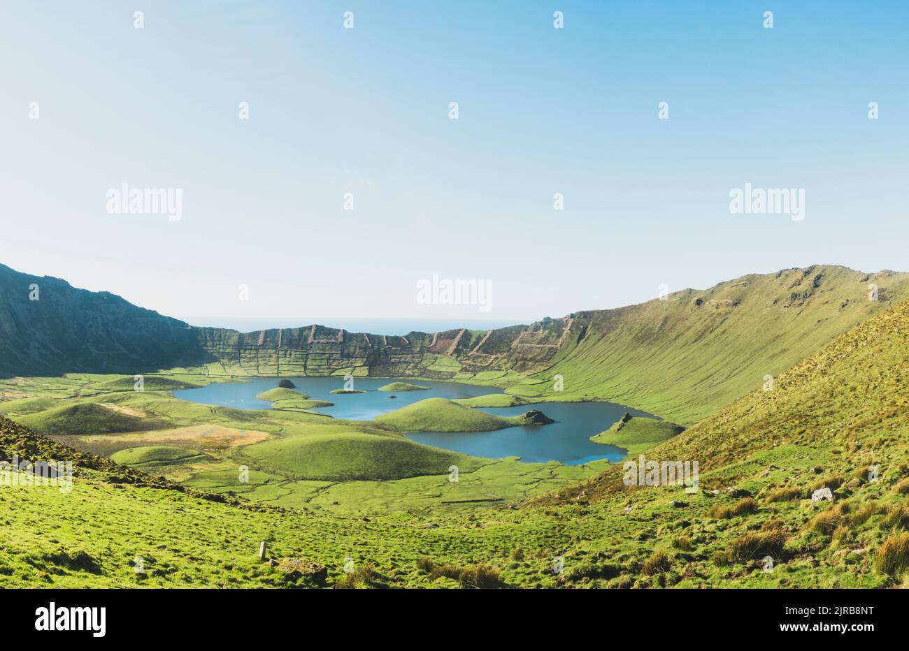 Idyllic view of lake amidst mountains at Corvo Island, Azores, Portugal ...