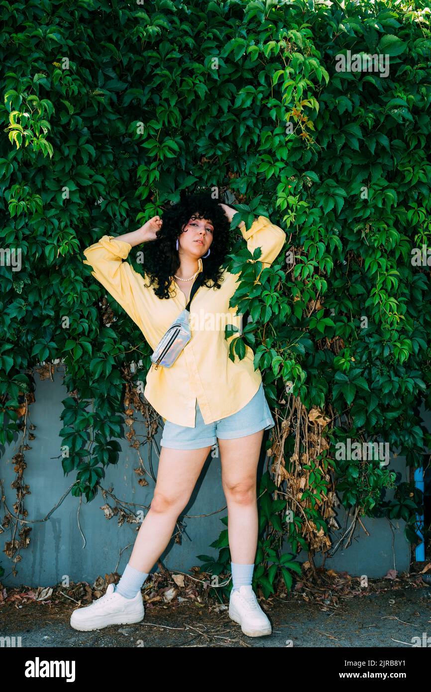 Woman behind bush hi-res stock photography and images - Alamy