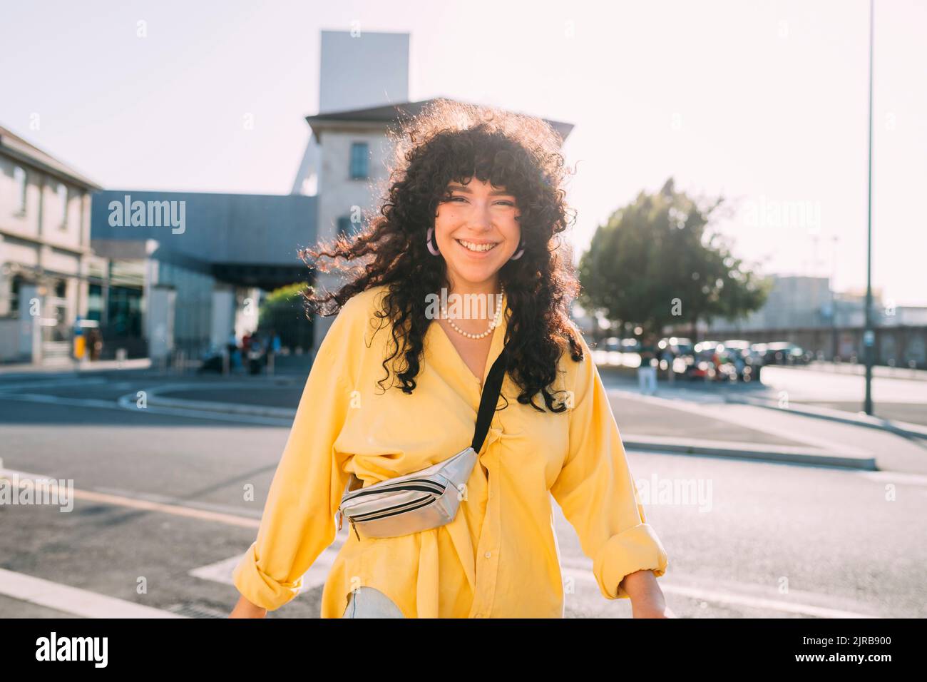 Happy black woman walking street hi-res stock photography and images ...
