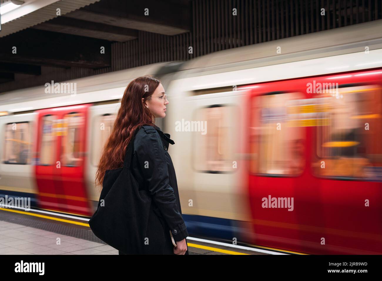 Young woman in subway hi-res stock photography and images - Alamy