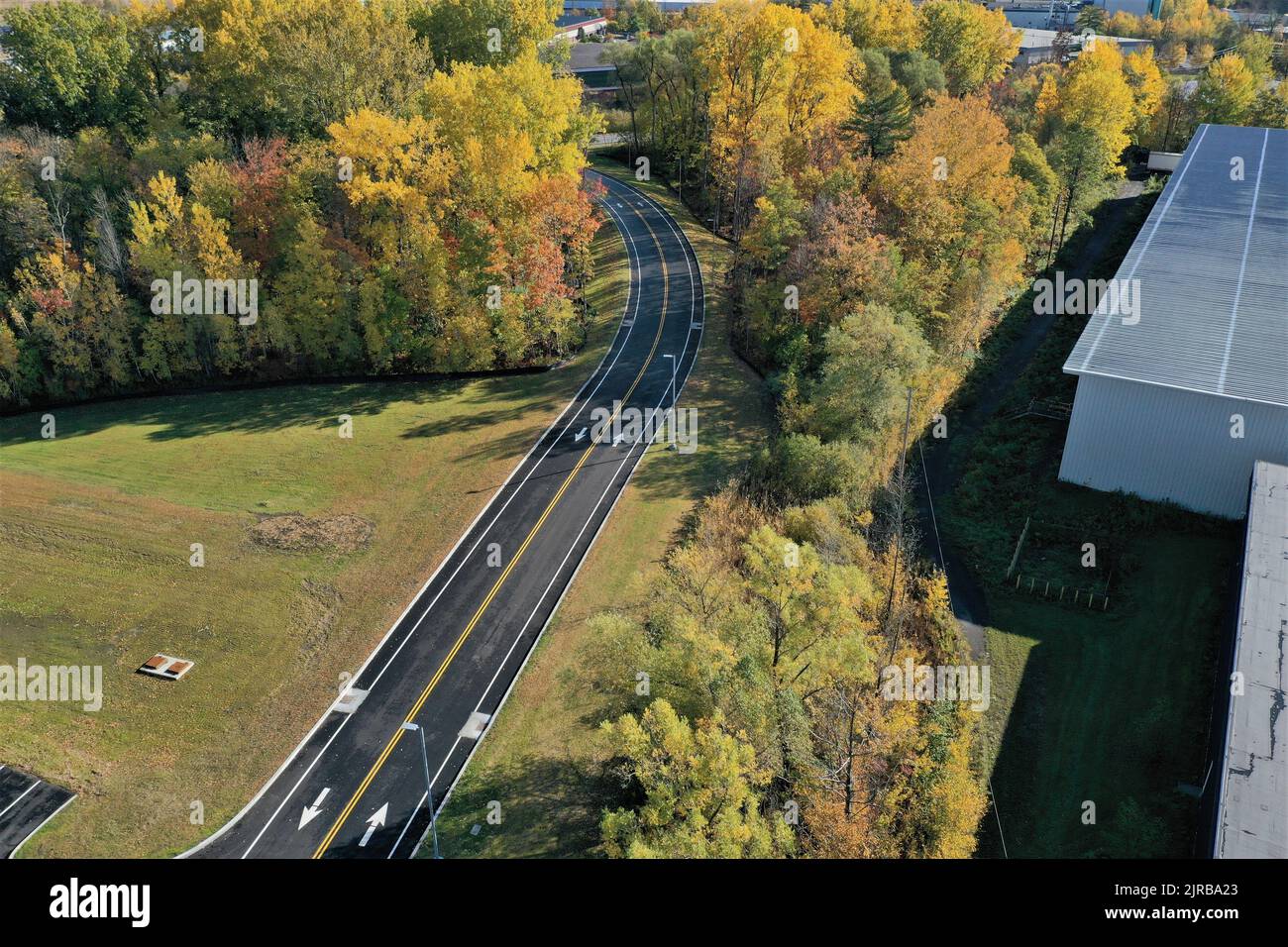 Scenic aerial view of a new driveway surrounded by autumn, fall ...
