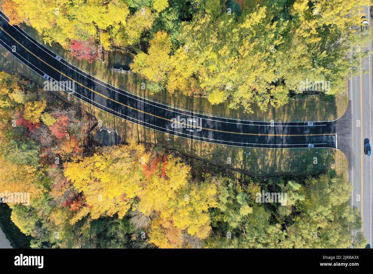 Scenic aerial view of a new driveway surrounded by autumn, fall ...