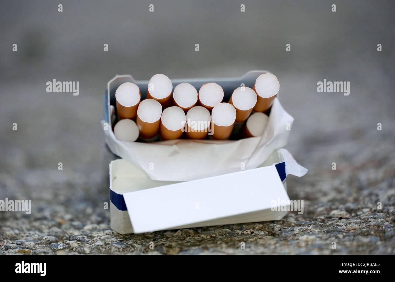 Pack of Cigarettes Close Up On a Concrete background Stock Photo - Alamy
