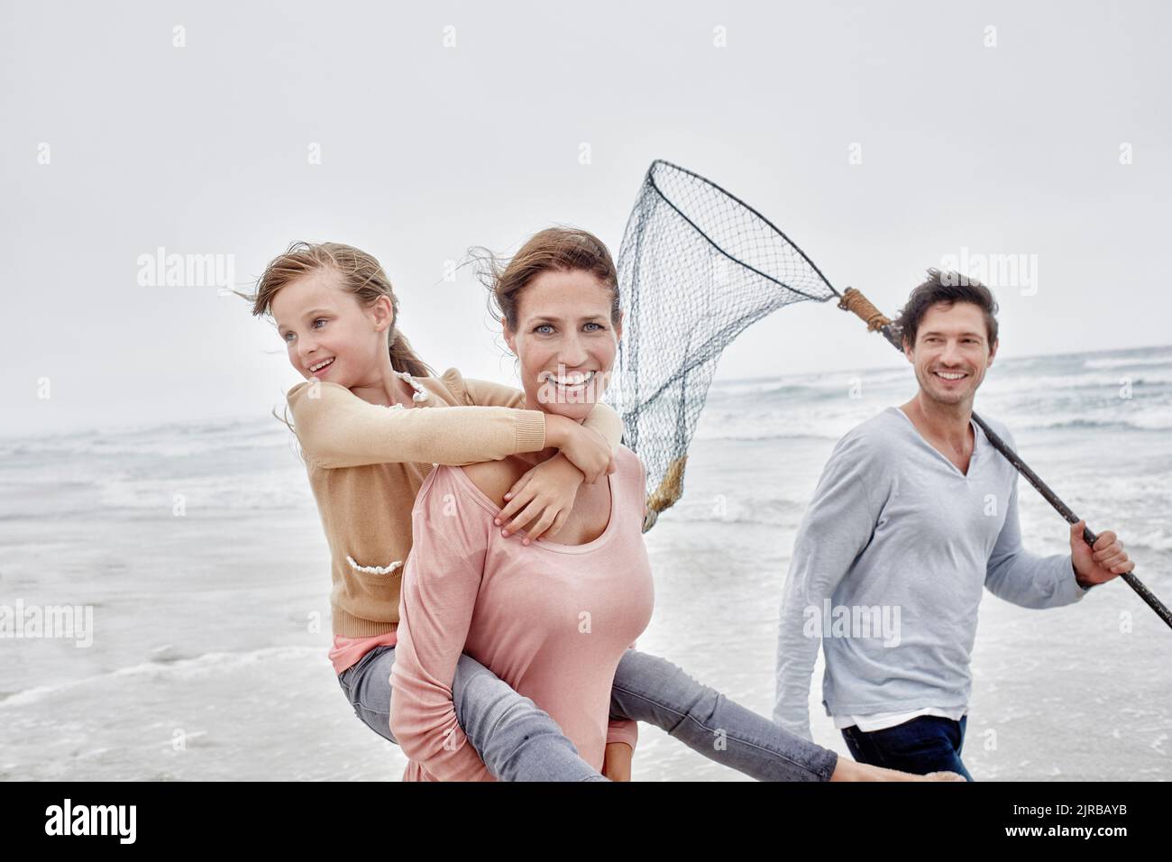 Woman fishing with net beach hi-res stock photography and images - Alamy