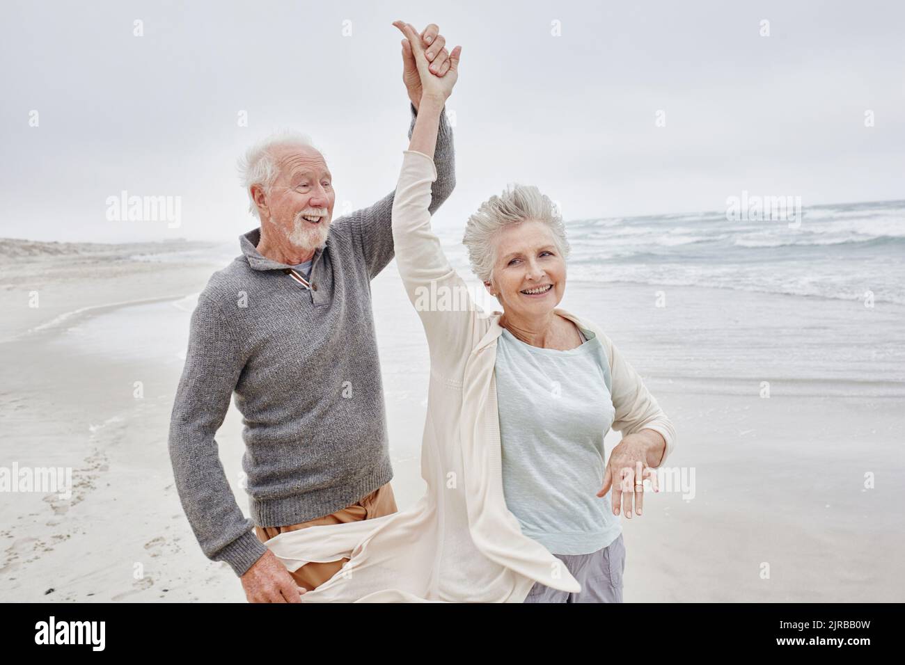 Happy senior couple dancing on the beach Stock Photo - Alamy