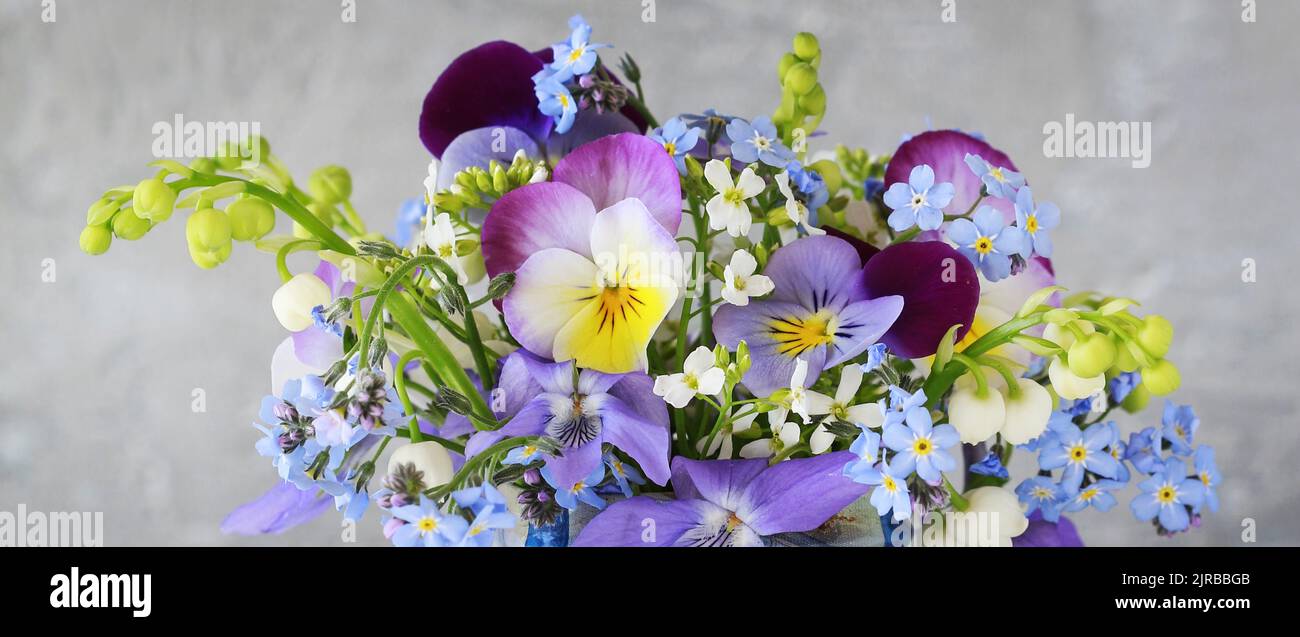 Pansy, forget-me-not, violet and lily of the valley flowers in one ...
