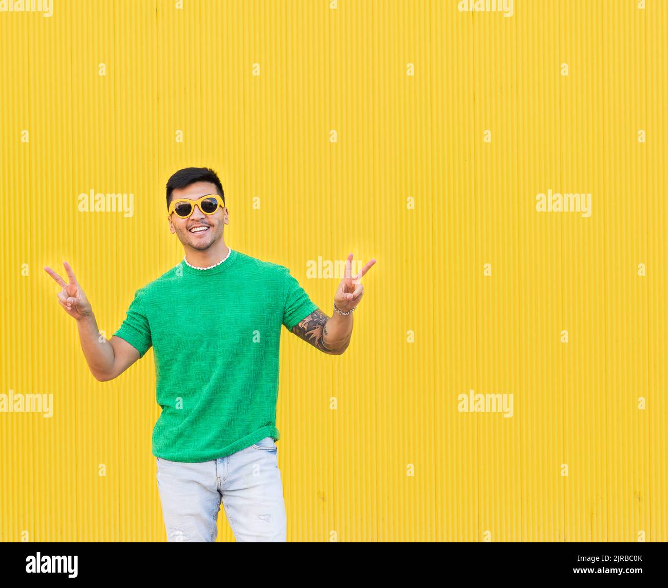 Asian man glasses yellow shirt hi-res stock photography and images - Alamy