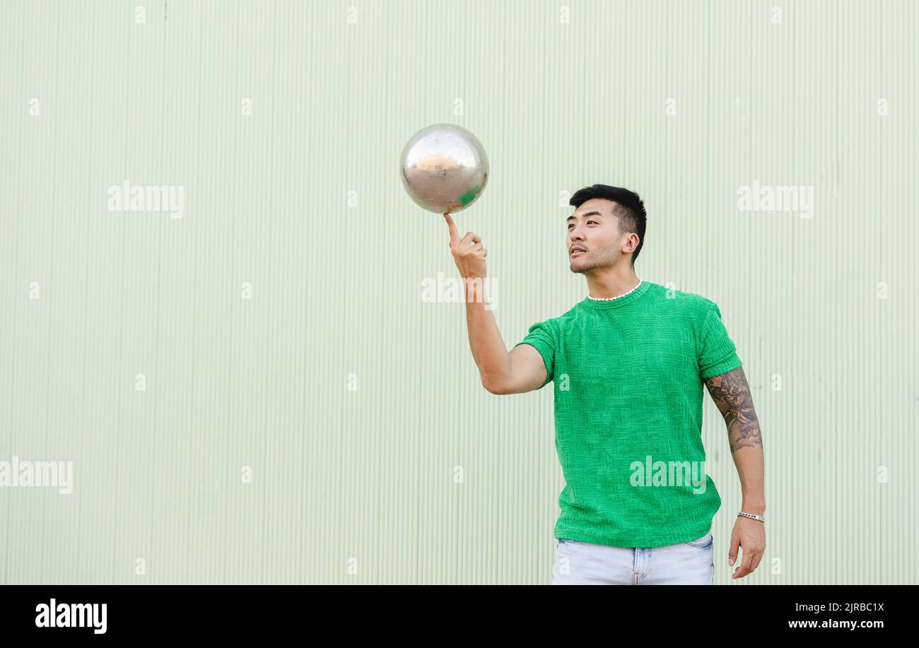 Young man spinning ball hi-res stock photography and images - Alamy