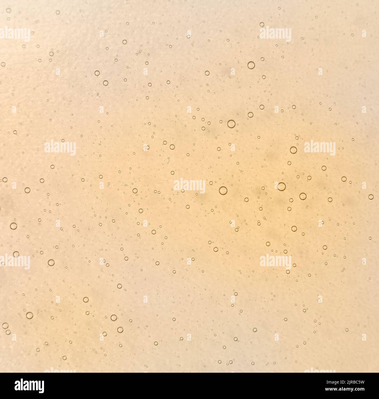 Shampoo honey bubble texture background. Ochre clean soap, cosmetics ...