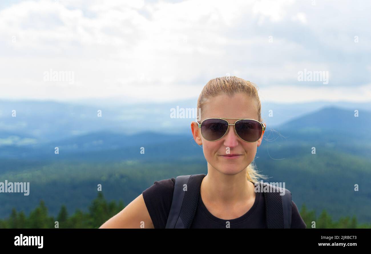Portrait of beauty young caucasian woman with sunglasses and backpack ...