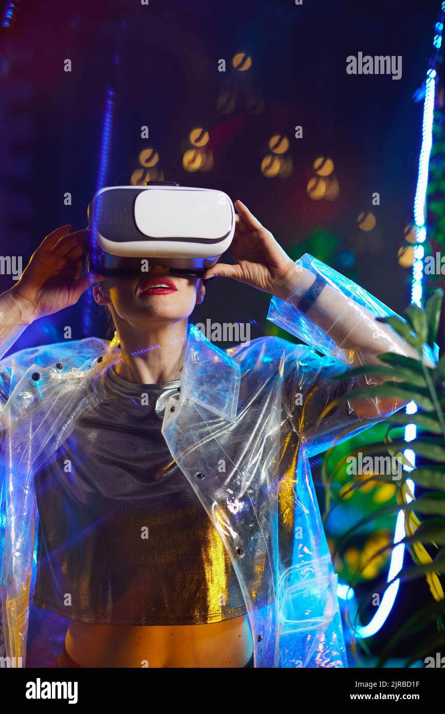 stylish woman in metaverse in vr goggles Stock Photo - Alamy