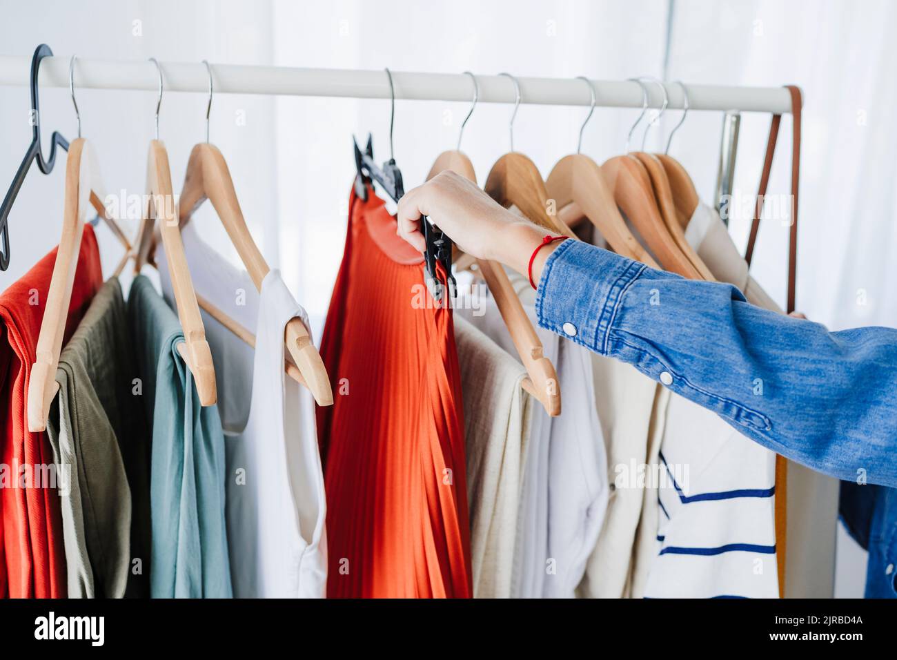 Hand clothes hanger hi-res stock photography and images - Alamy