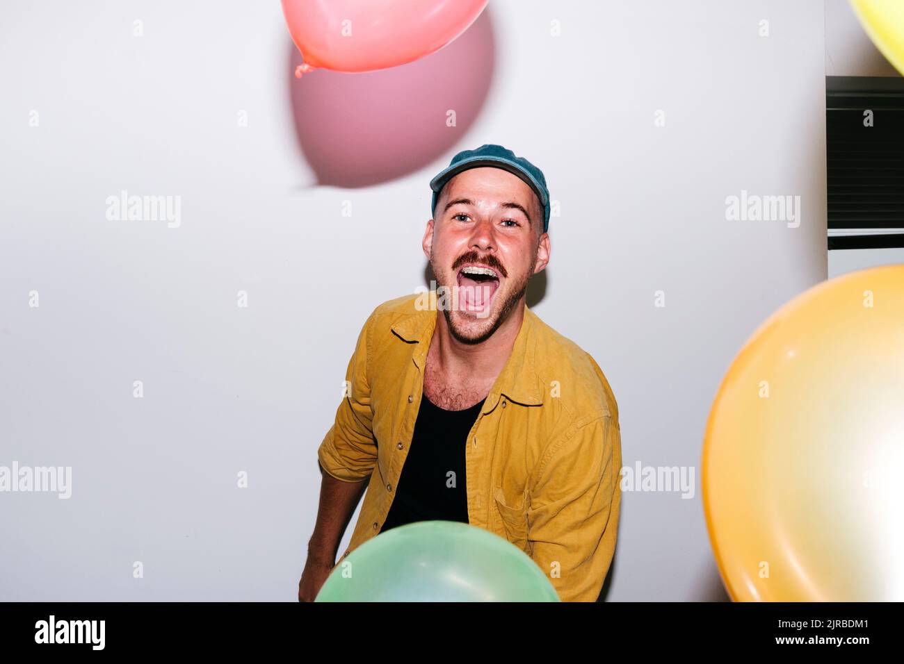 Helium balloons man hi-res stock photography and images - Alamy