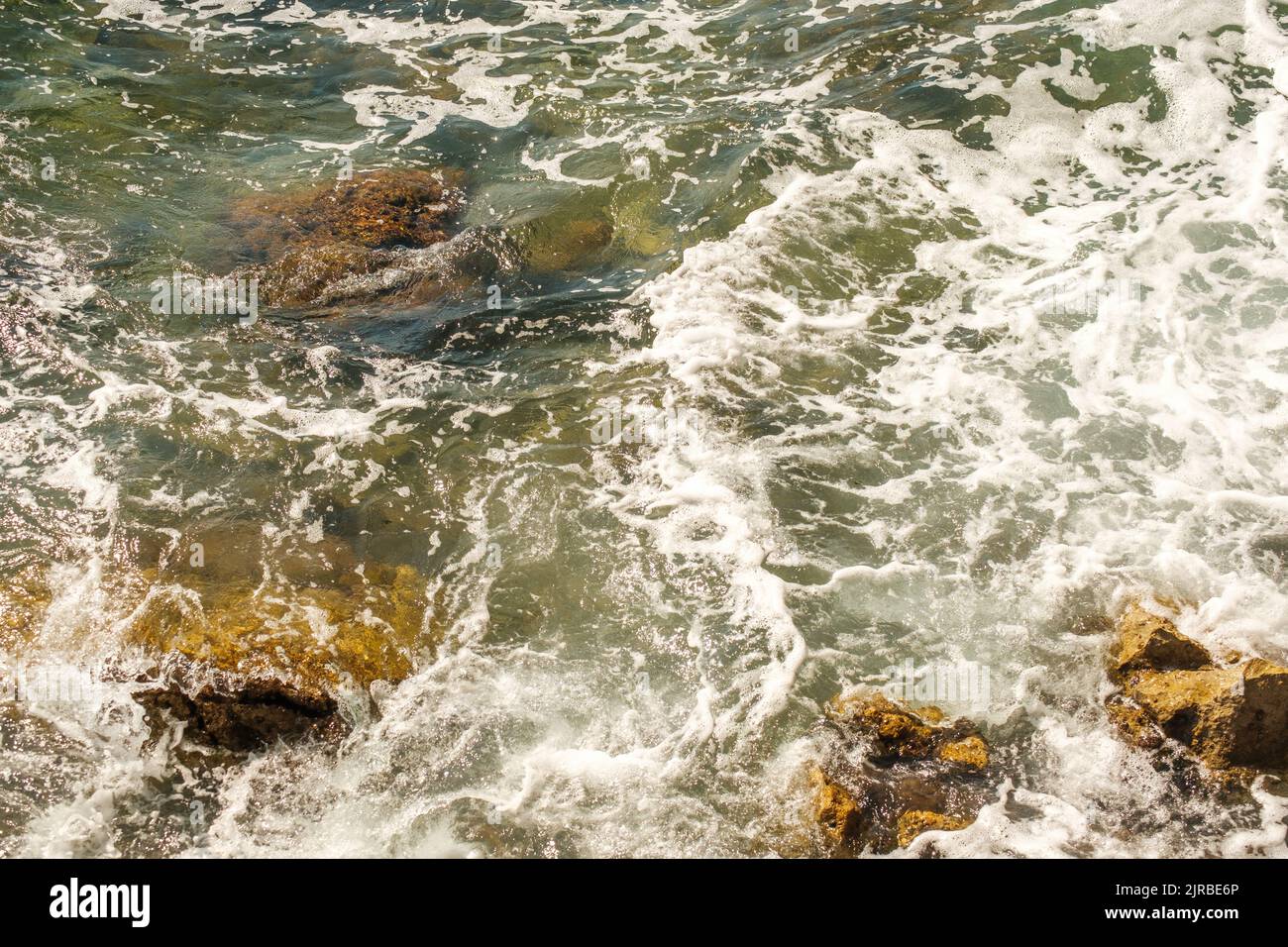Sea waves breaking on rocks and hitting the shore Stock Photo - Alamy