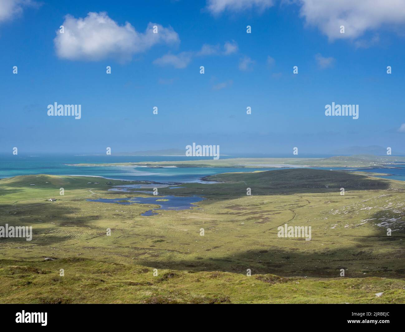 UK, Scotland, Clouds casting shadows over coastline of Outer Hebrides ...
