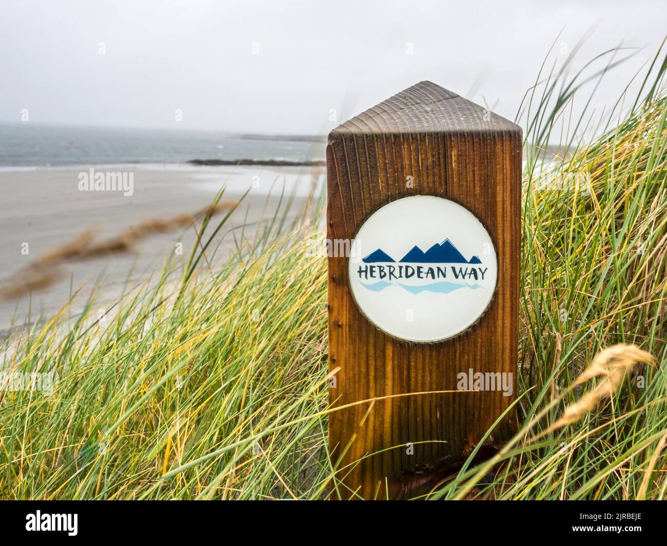 UK, Scotland, Hebridean Way trail marker standing in grass Stock Photo ...