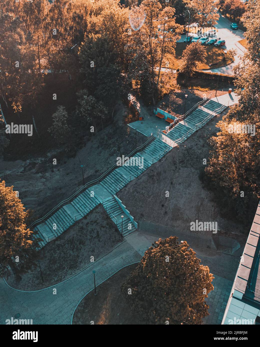 An aerial shot of stairs in a park in Starachowice Poland surrounded by ...