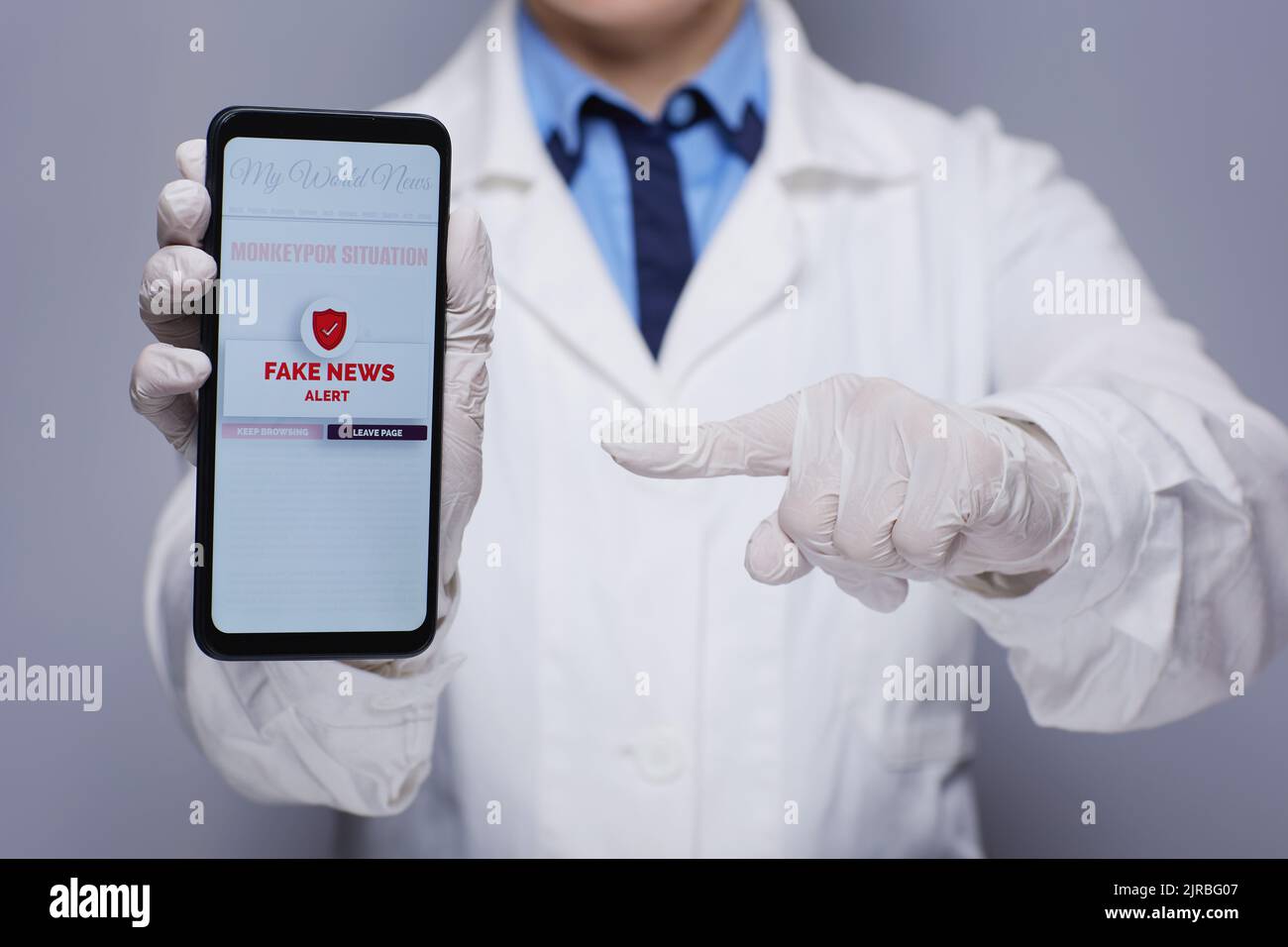 Closeup on modern medical doctor woman in white medical robe showing ...