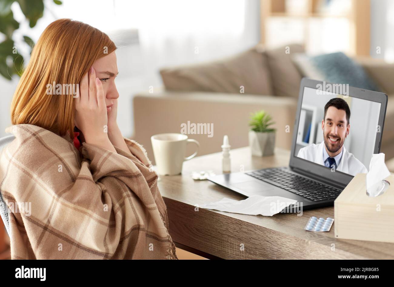 sick woman having video call with doctor at home Stock Photo - Alamy