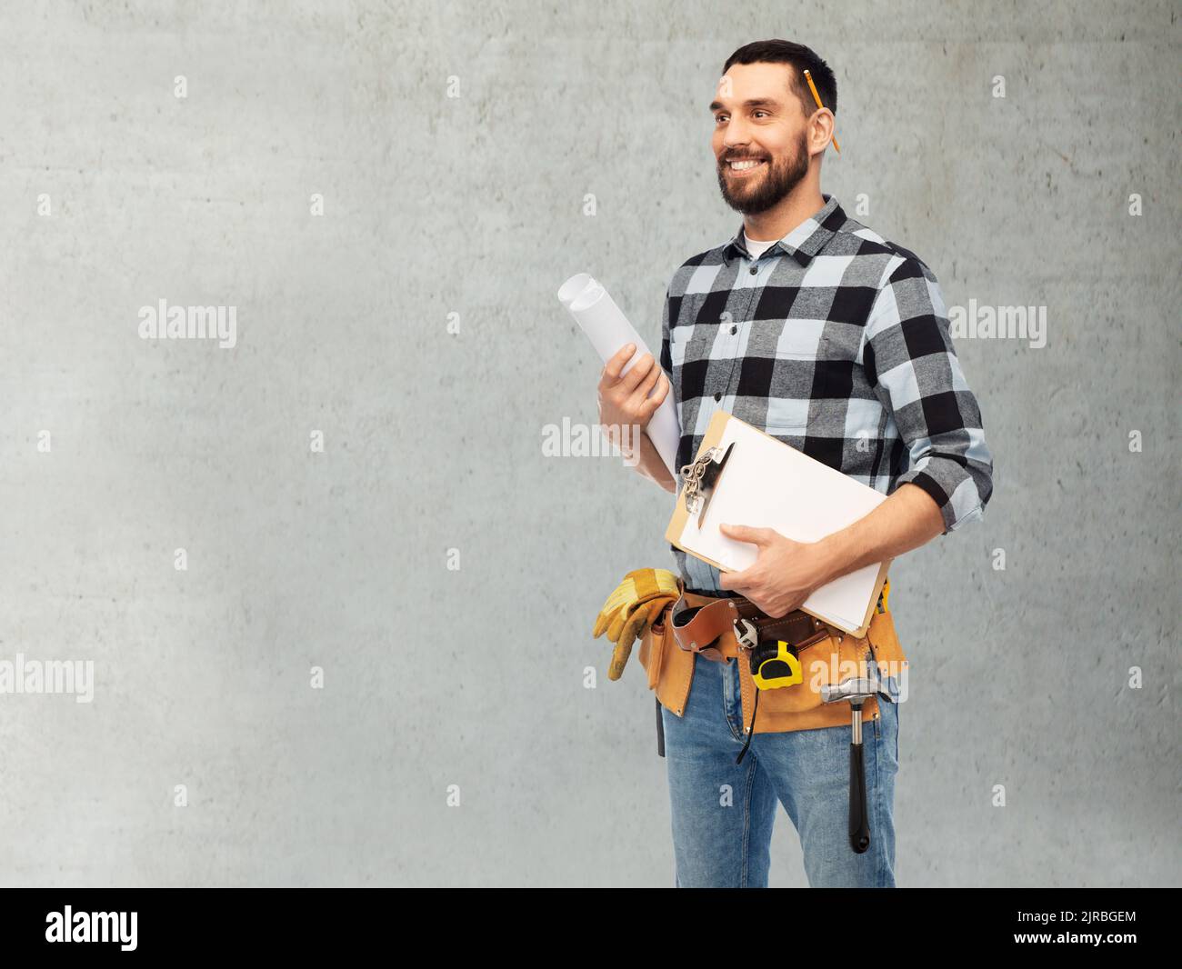 male builder with clipboard and blueprint Stock Photo - Alamy