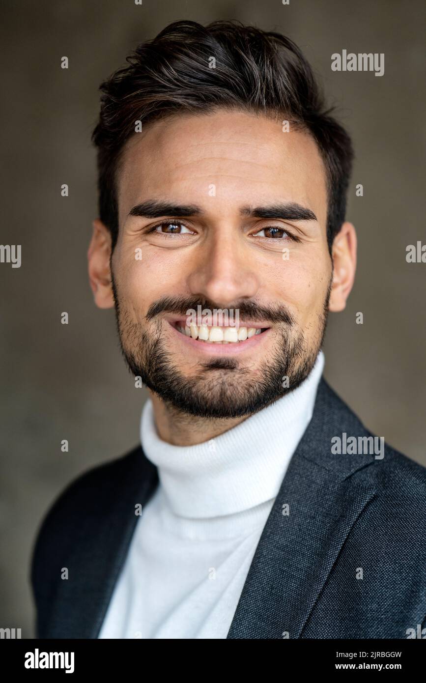 Handsome young businessman wearing business casual Stock Photo - Alamy